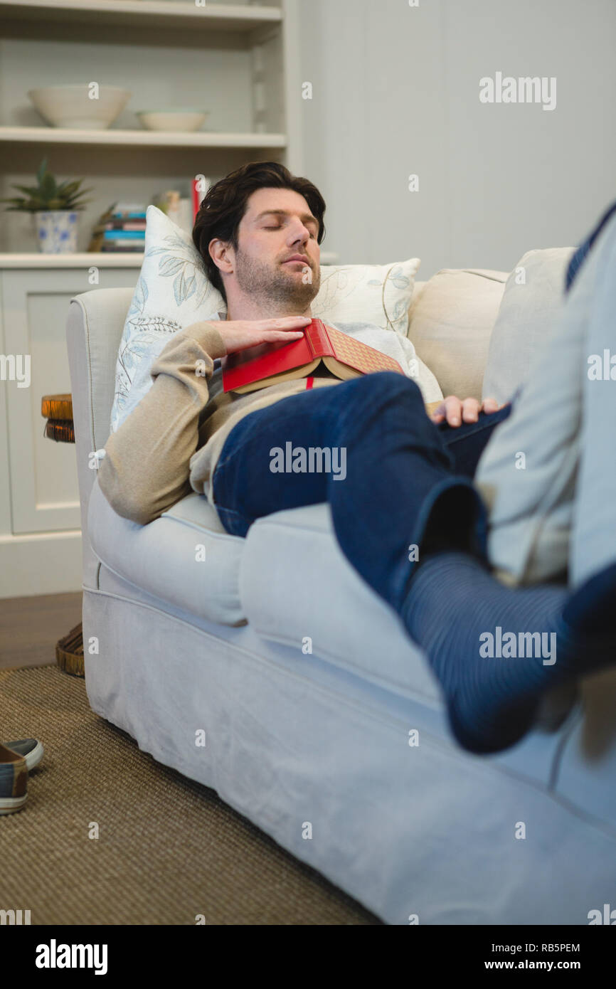 Man sleeping sofa hi-res stock photography and images - Alamy