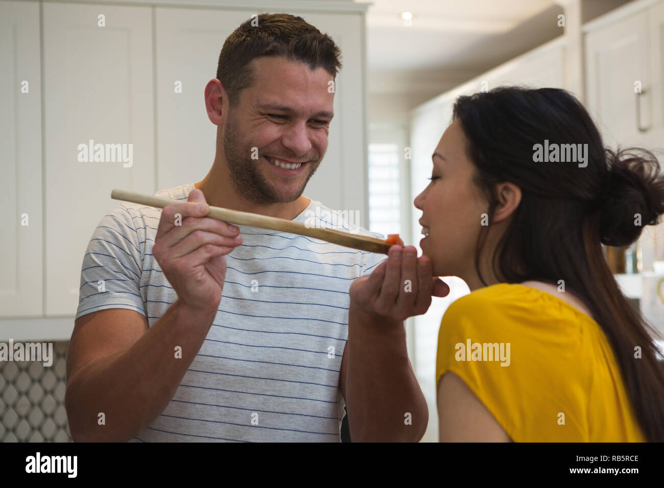 Man feeding woman hi-res stock photography and images - Alamy