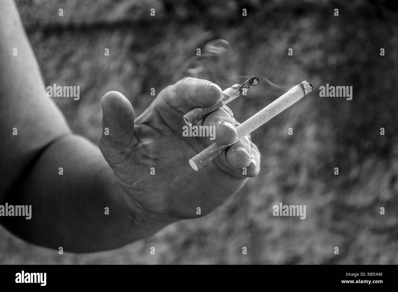 Hand Holding Cigar High Resolution Stock Photography and Images - Alamy