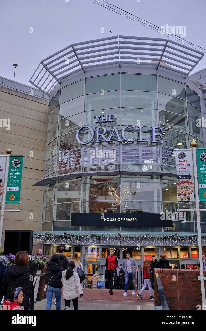 People entering and leaving The Oracle shopping centre through its main ...