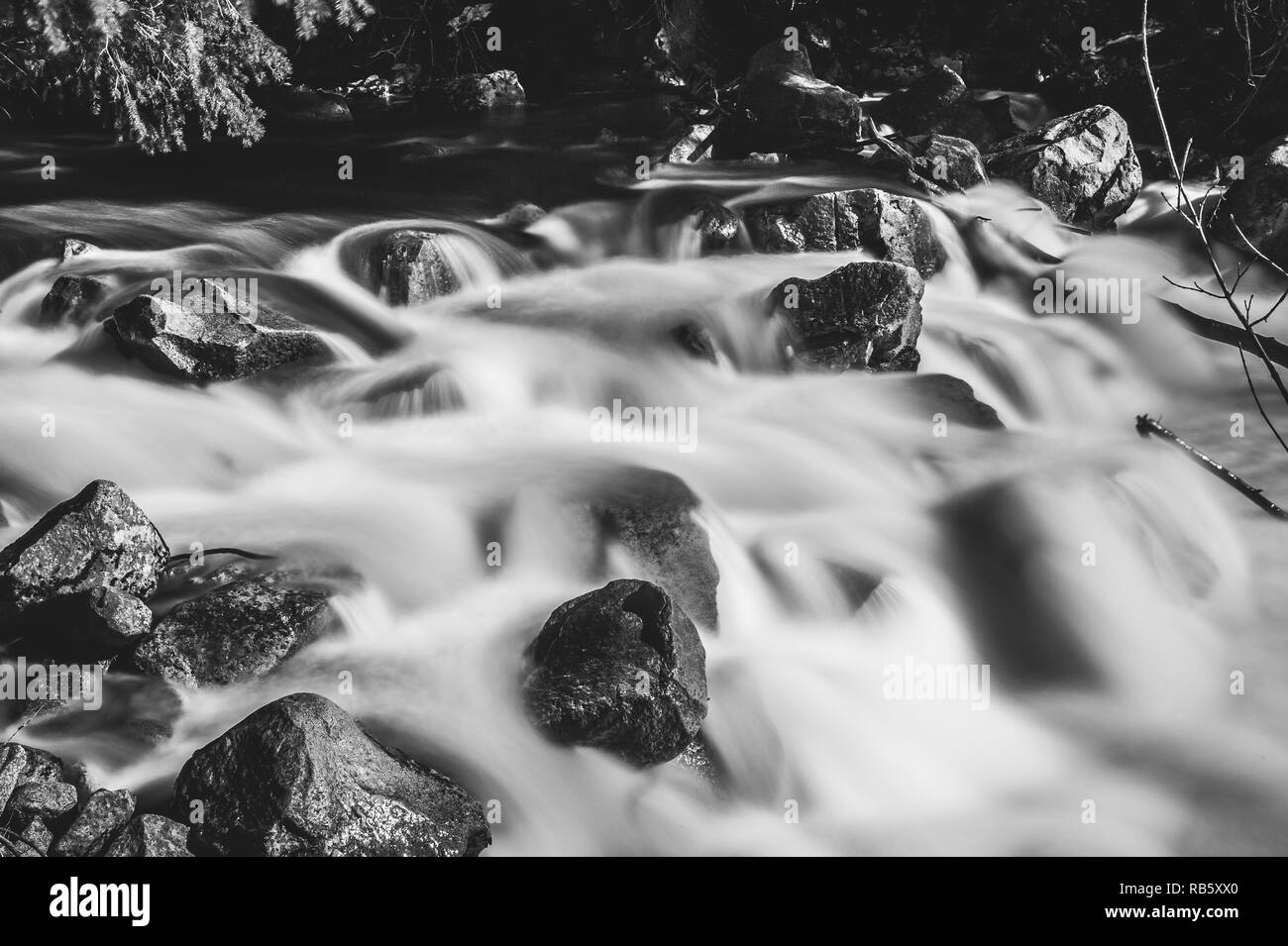 Rock in river stream Black and White Stock Photos & Images - Alamy