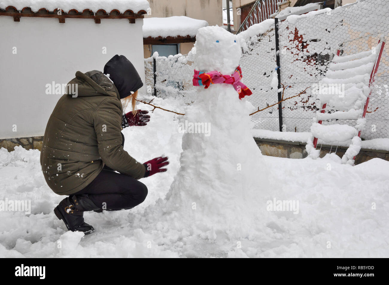 making a snowman Stock Photo - Alamy