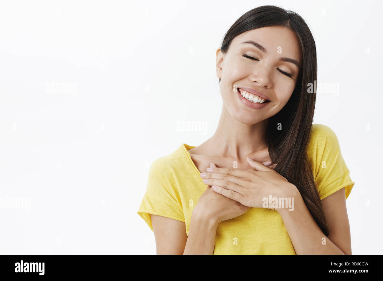 Charming touched and delighted young slim female with dark hair in ...