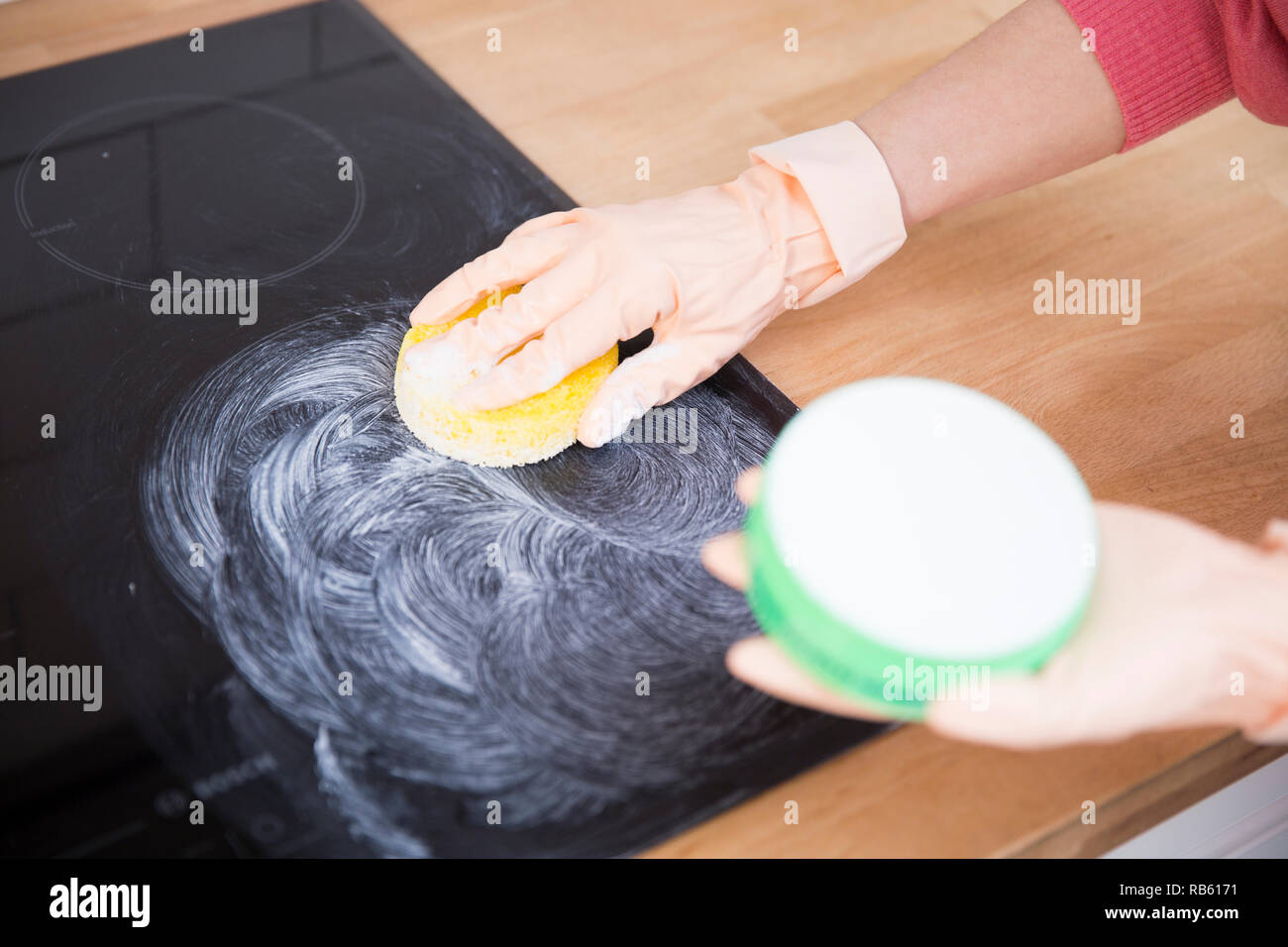 Woman using a clay bar Stock Photo - Alamy