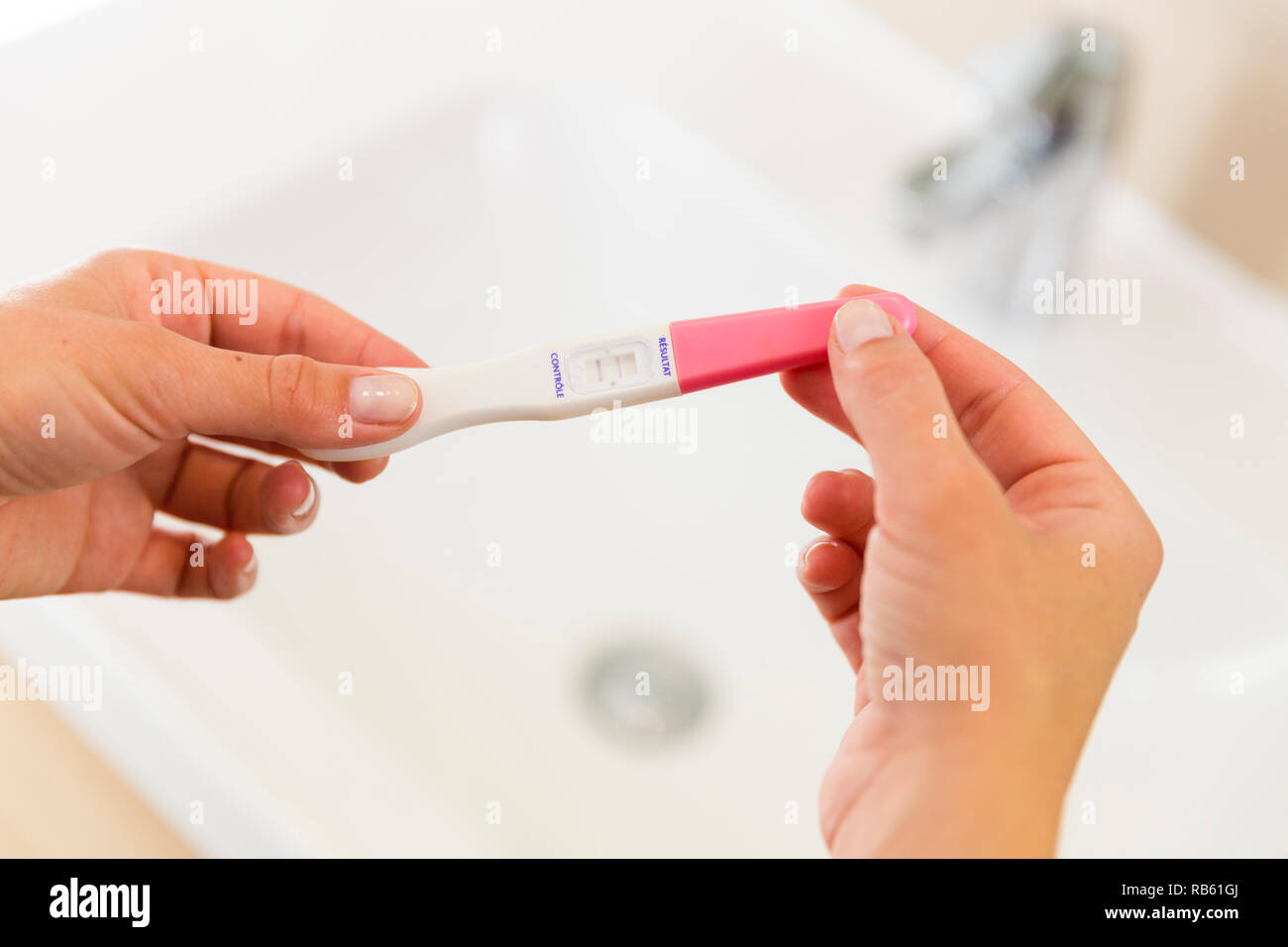 Positive pregnancy test Stock Photo - Alamy