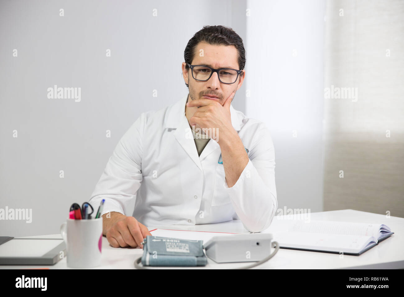 Doctor at his desk Stock Photo - Alamy
