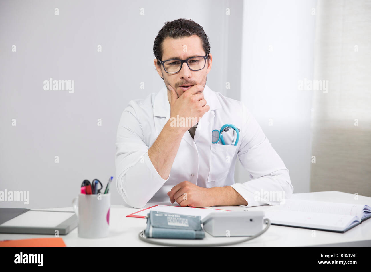 Doctor at his desk Stock Photo - Alamy