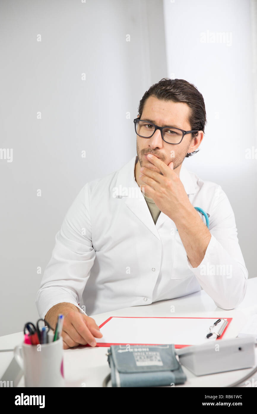 Doctor at his desk Stock Photo - Alamy