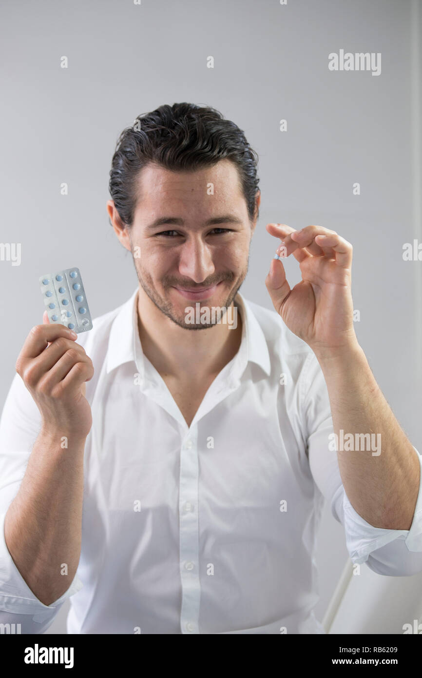 Man taking contraceptive pill Stock Photo - Alamy