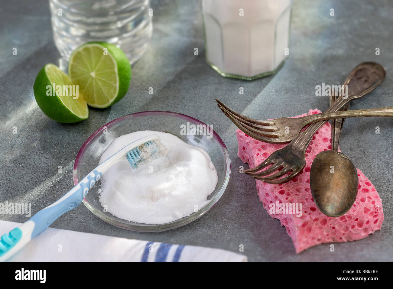 Baking soda, lemon with sponge and towel for effective and safe house ...