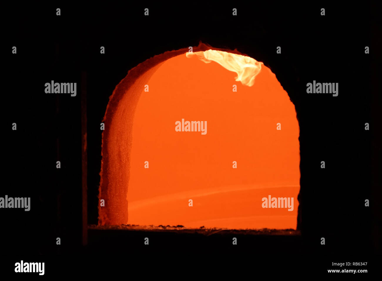 melted glass blow factory detail of work Stock Photo - Alamy