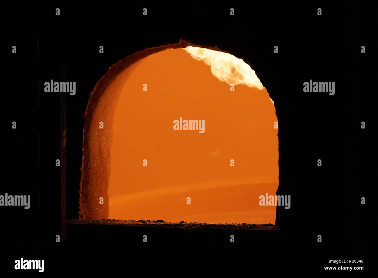 melted glass blow factory detail of work Stock Photo - Alamy