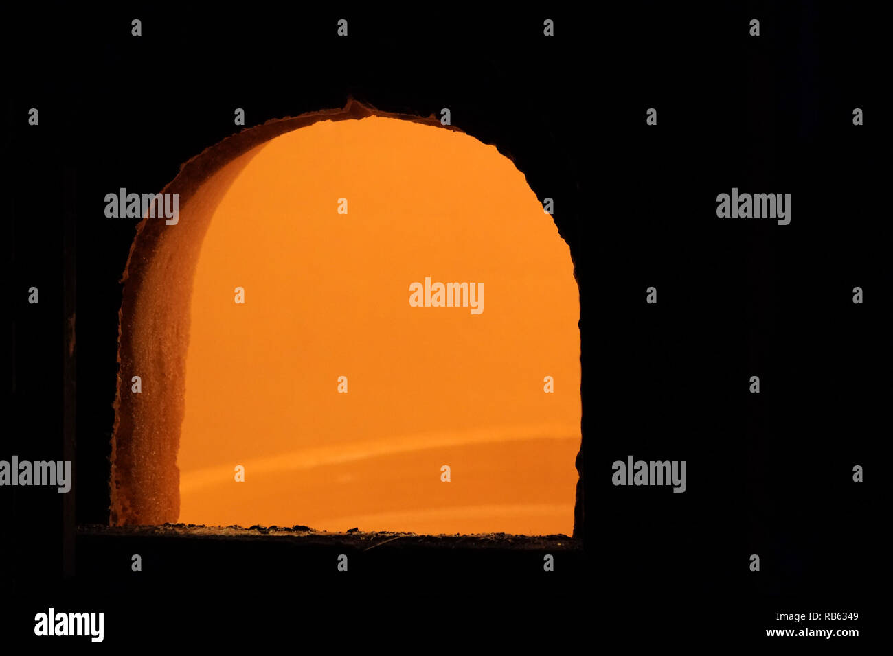 melted glass blow factory detail of work Stock Photo - Alamy