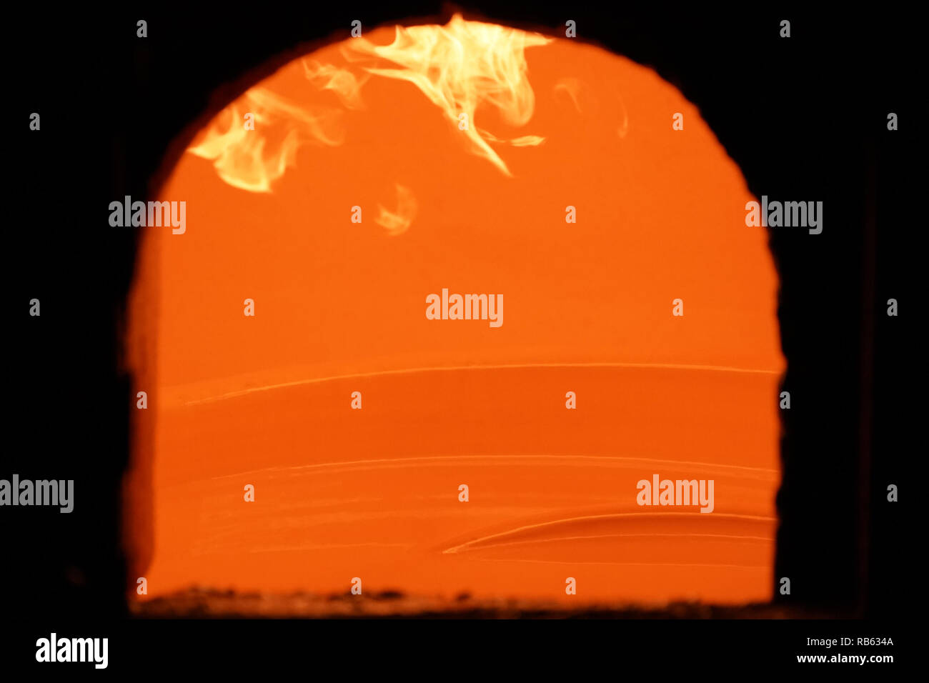 melted glass blow factory detail of work Stock Photo - Alamy