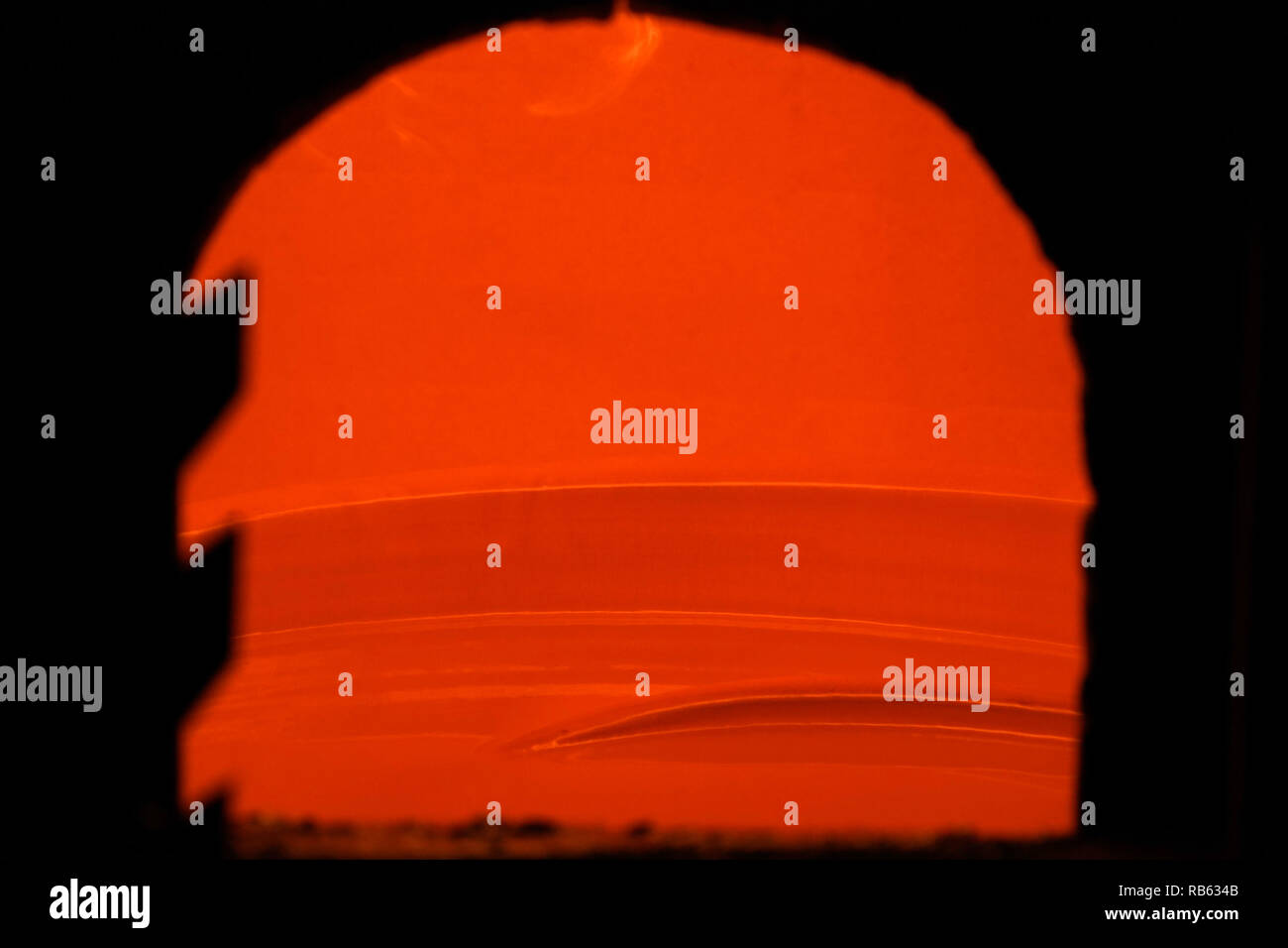 melted glass blow factory detail of work Stock Photo - Alamy