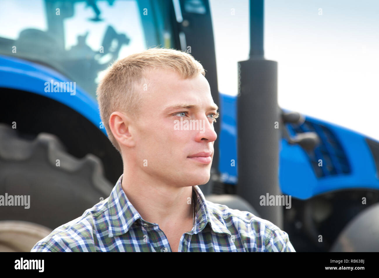 Farmer posing with tractor hi-res stock photography and images - Alamy