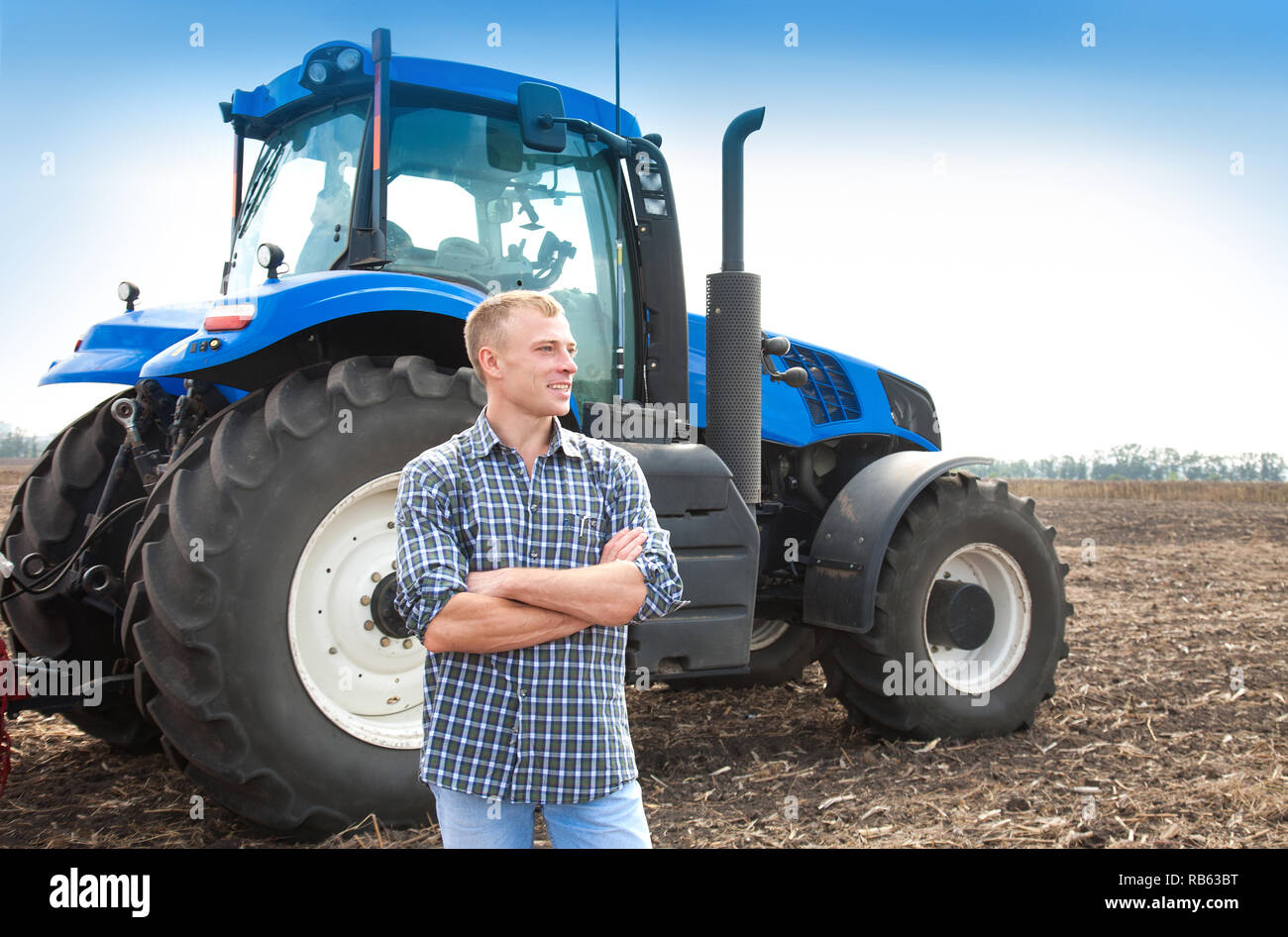 Man works near tractor in hi-res stock photography and images - Alamy