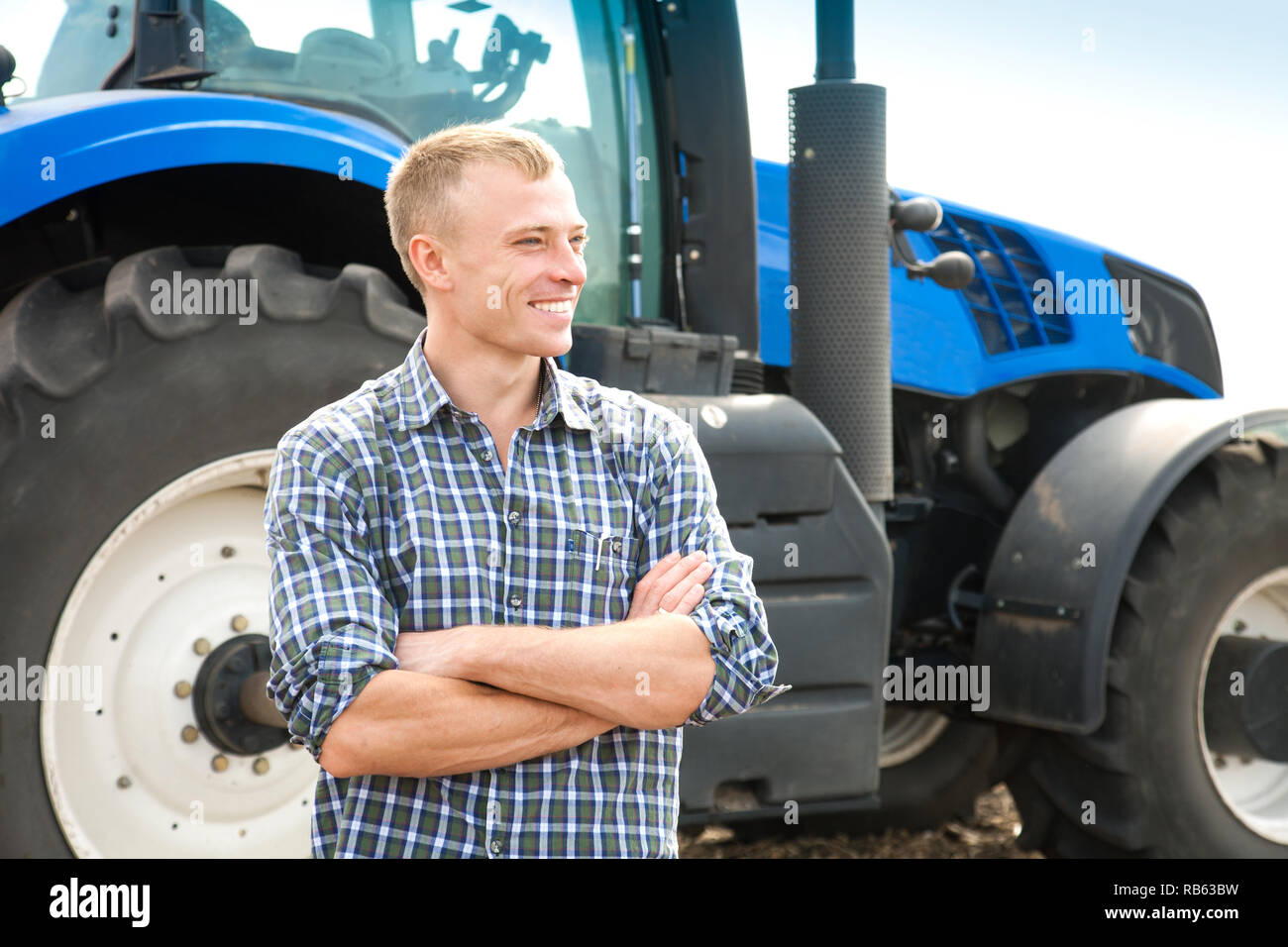Farmer posing with tractor hi-res stock photography and images - Alamy