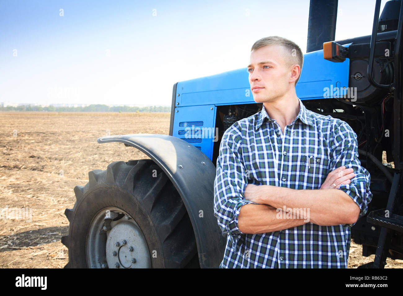 Man works near tractor in hi-res stock photography and images - Alamy