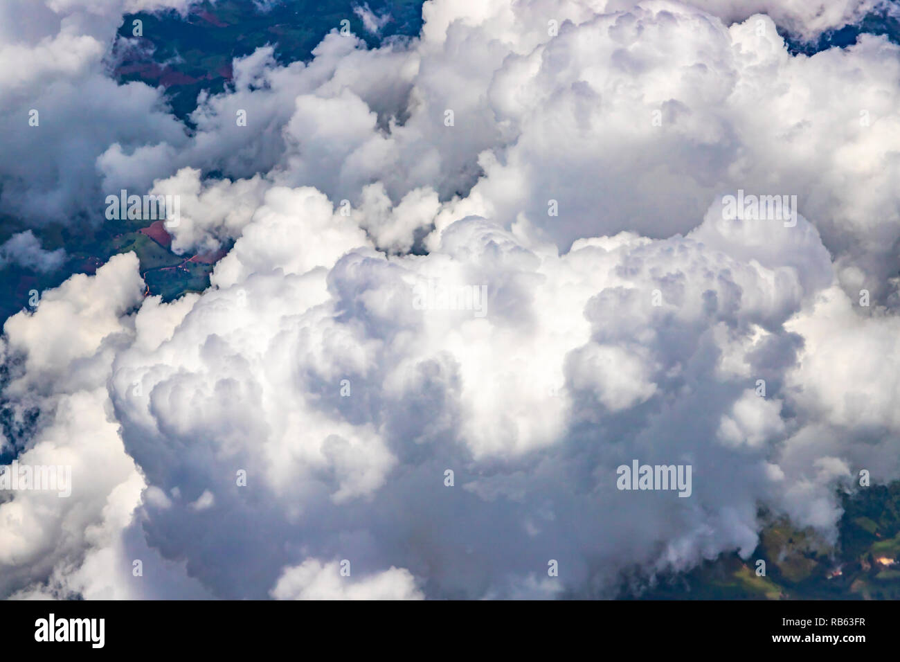 Beautiful view from the window of a plane flying over clouds. Natural ...