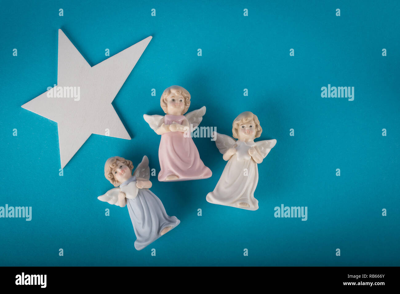 Christmas composition - three guardian angels and big white star Stock ...
