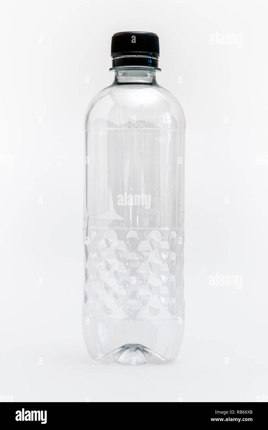 An empty generic single use plastic water bottle on a white background ...