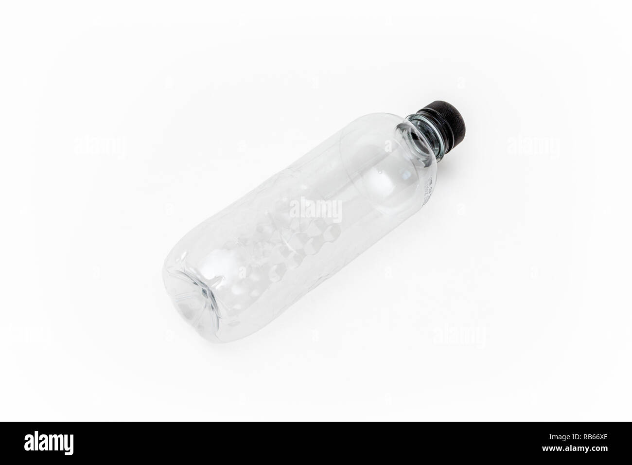 An empty generic single use plastic water bottle on a white background ...