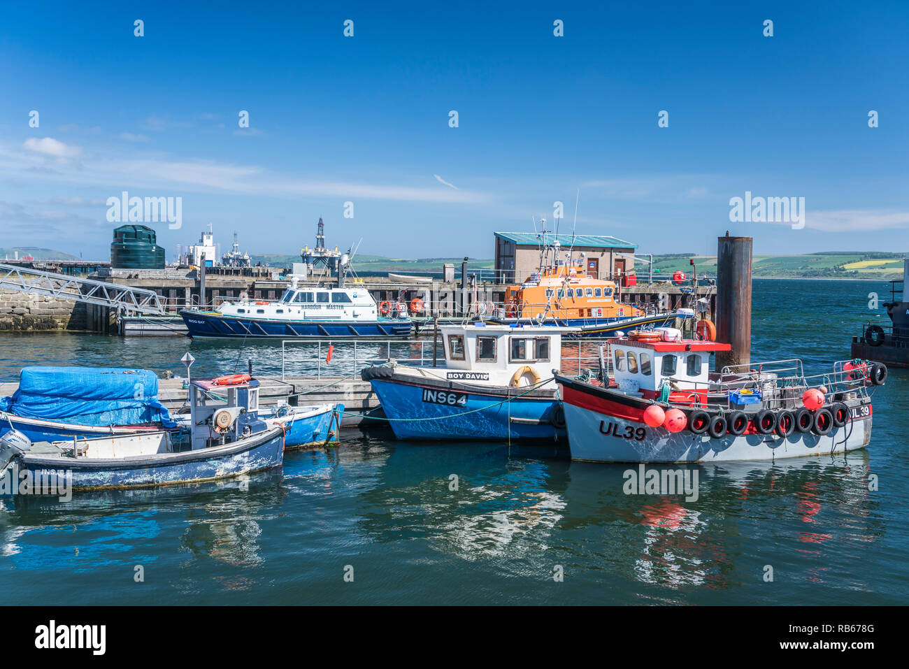 Colorful boats at the port of Invergordon, Scotland, United Kingdom ...