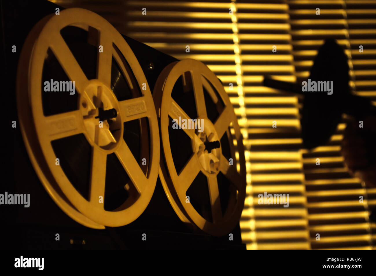 A covert CIA agent eavesdrops with a directional microphone and tapes ...