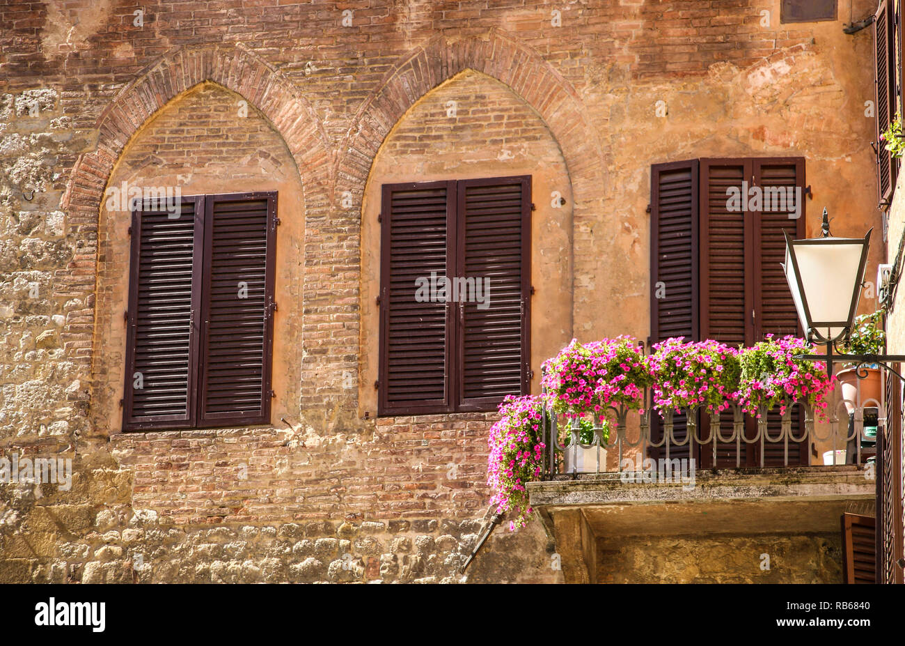 Traditional Italian windows with shutters in one of the houses of Siena ...