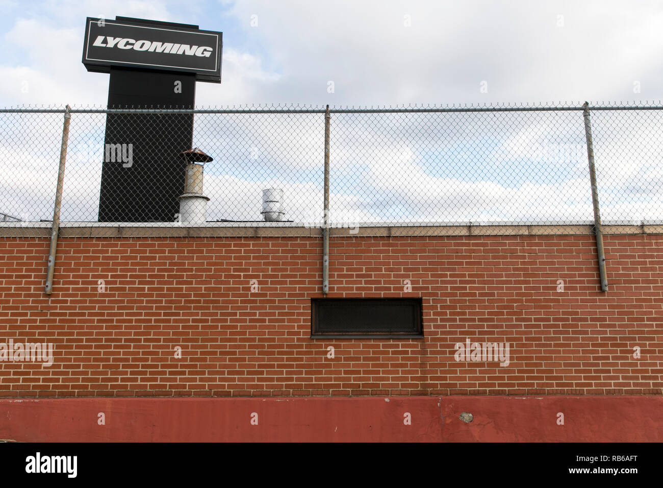 A logo sign outside of a facility occupied by Lycoming Engines in ...