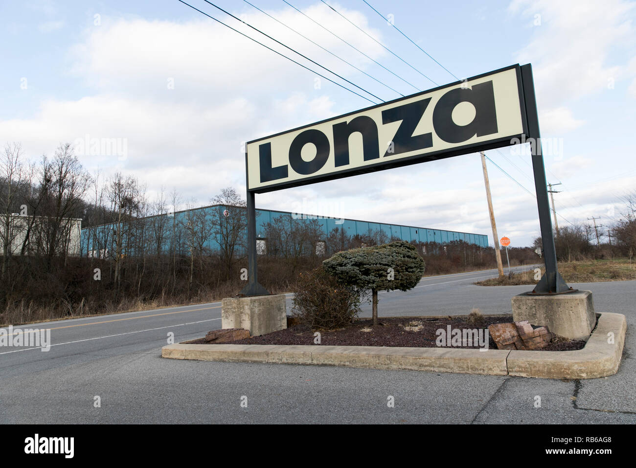 A logo sign outside of a facility occupied by the Lonza Group in ...