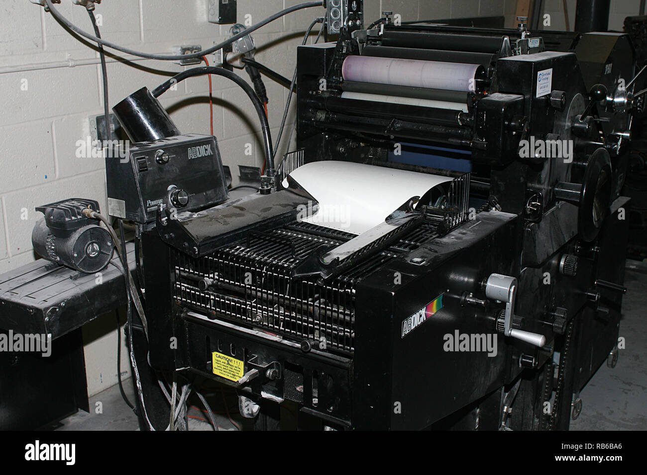 Working Printing press in a print shop Stock Photo - Alamy