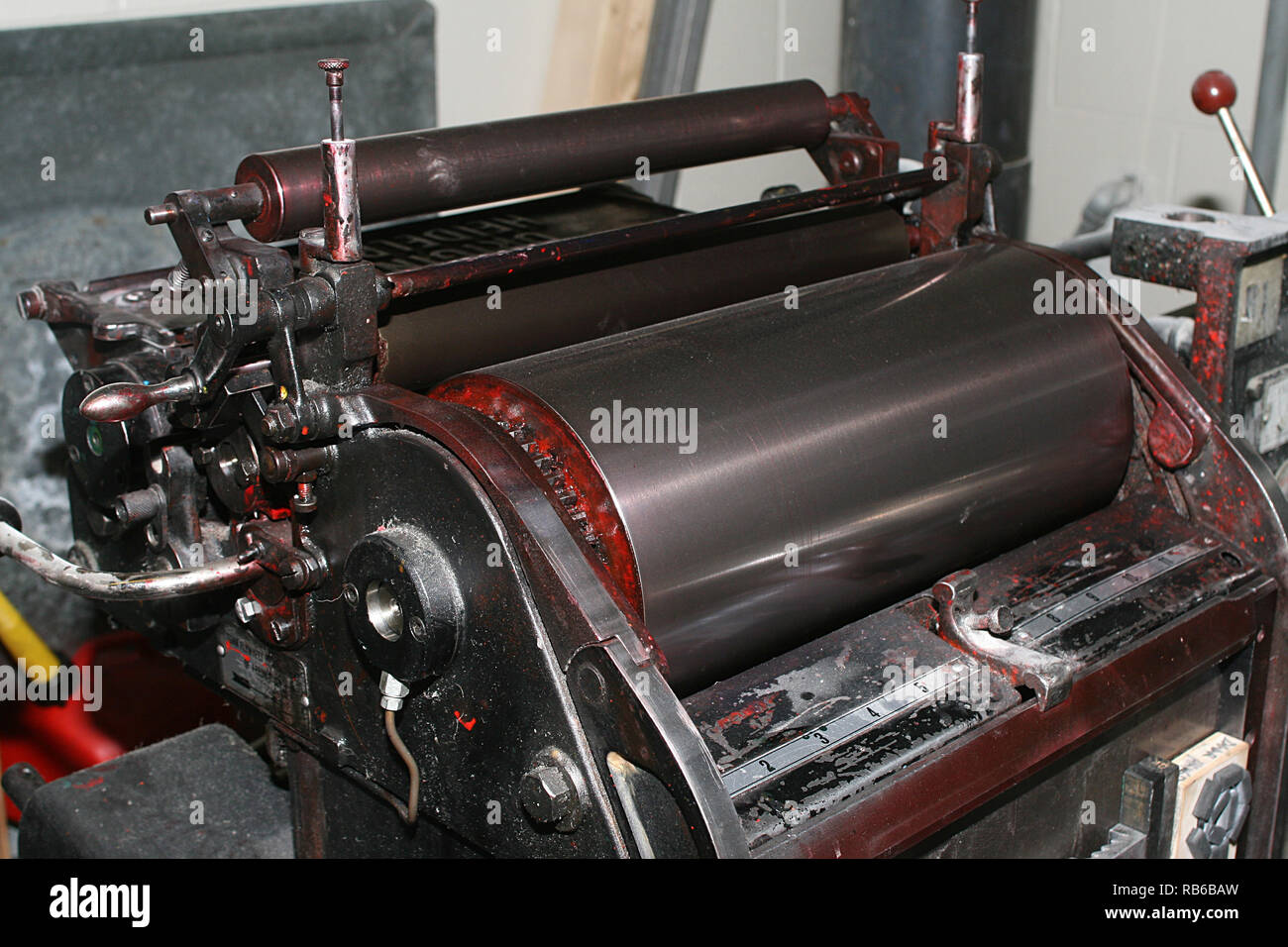 Working Printing press in a print shop Stock Photo - Alamy