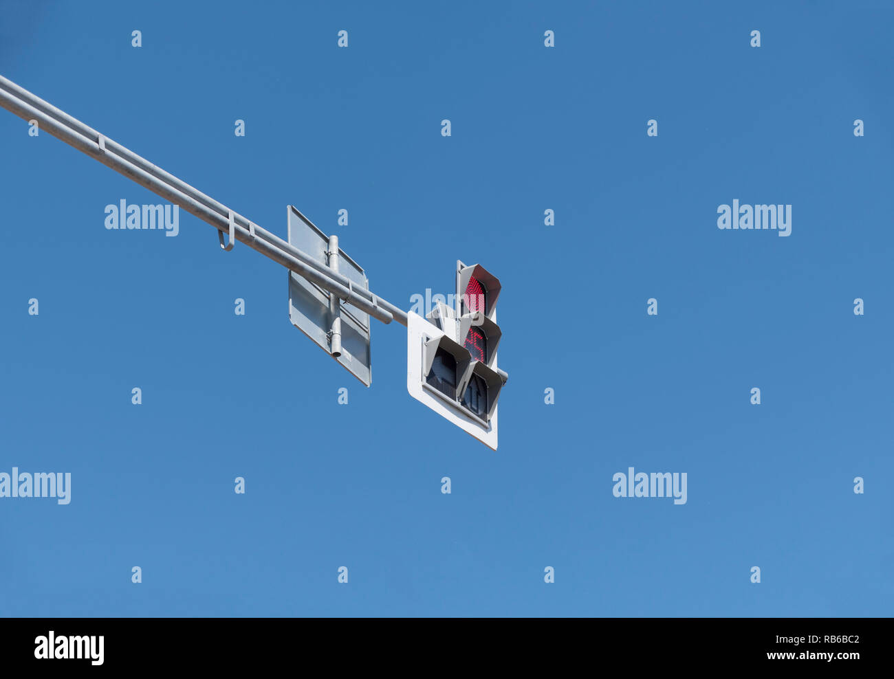 Red traffic signs with the direction of travel Stock Photo - Alamy