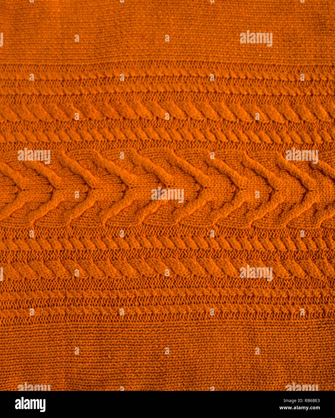 Orange Brown Terracotta Knitted pattern wool sweater texture close up ...