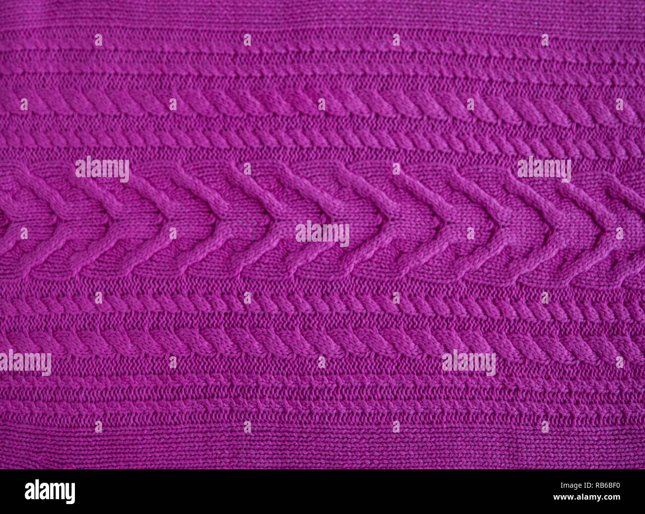 Pink purple magenta Knitted pattern wool sweater texture close up ...