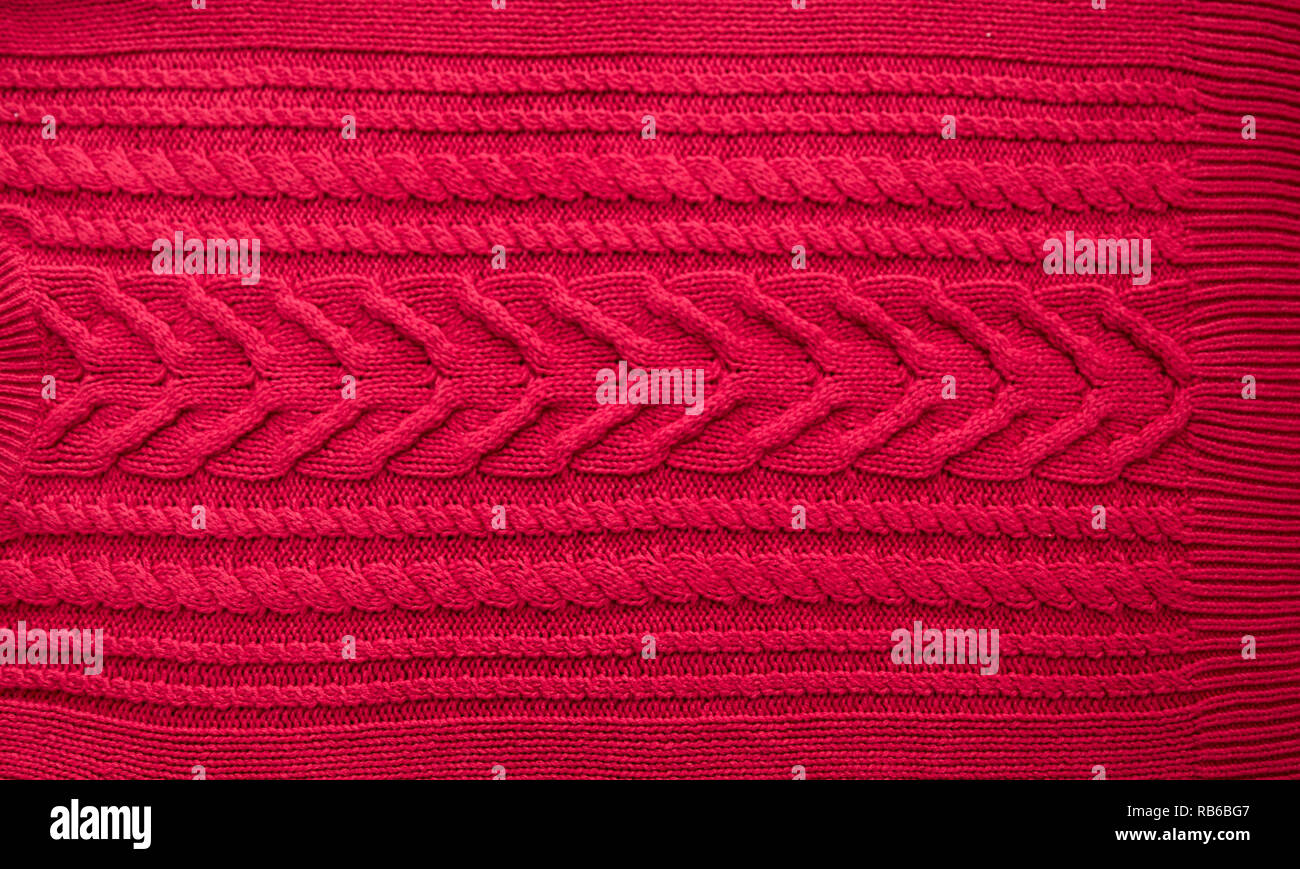 Red Knitted pattern wool sweater texture close up. Handmade red ...