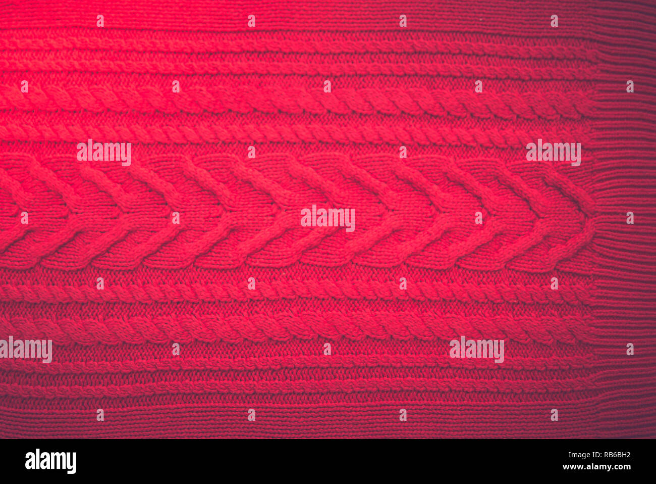 Red Knitted pattern wool sweater texture close up. Handmade red ...