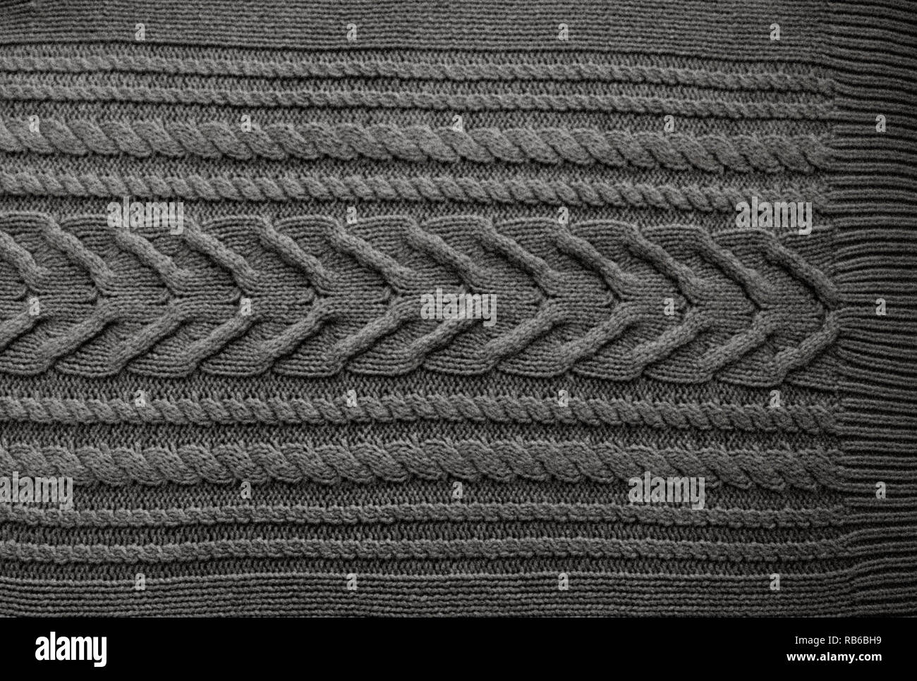 Grey Black Knitted pattern wool sweater texture close up. Handmade grey ...