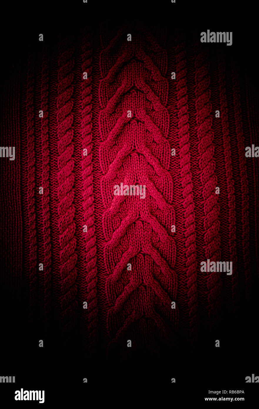Red Knitted pattern wool sweater texture close up. Handmade red ...