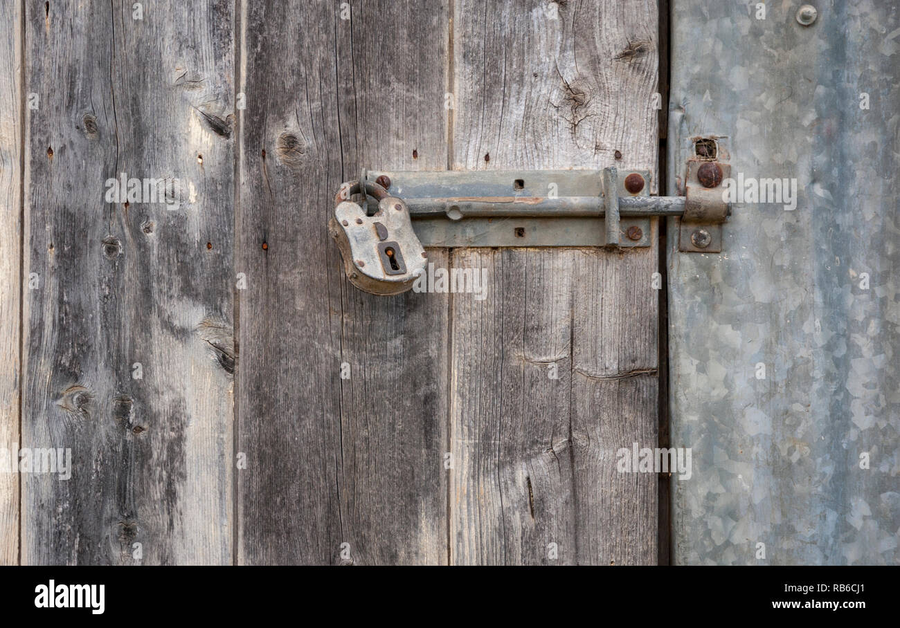 Old bolt and lock on old, weathered door Stock Photo - Alamy