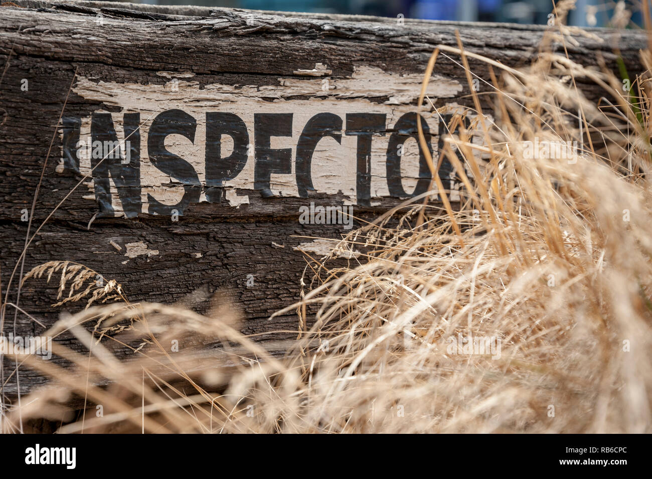 Old inspector parking sign Stock Photo - Alamy