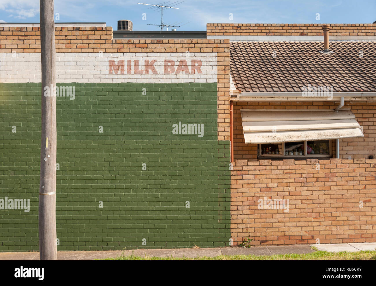 Old and faded Milk Bar sign on the side of a brick wall Stock Photo - Alamy
