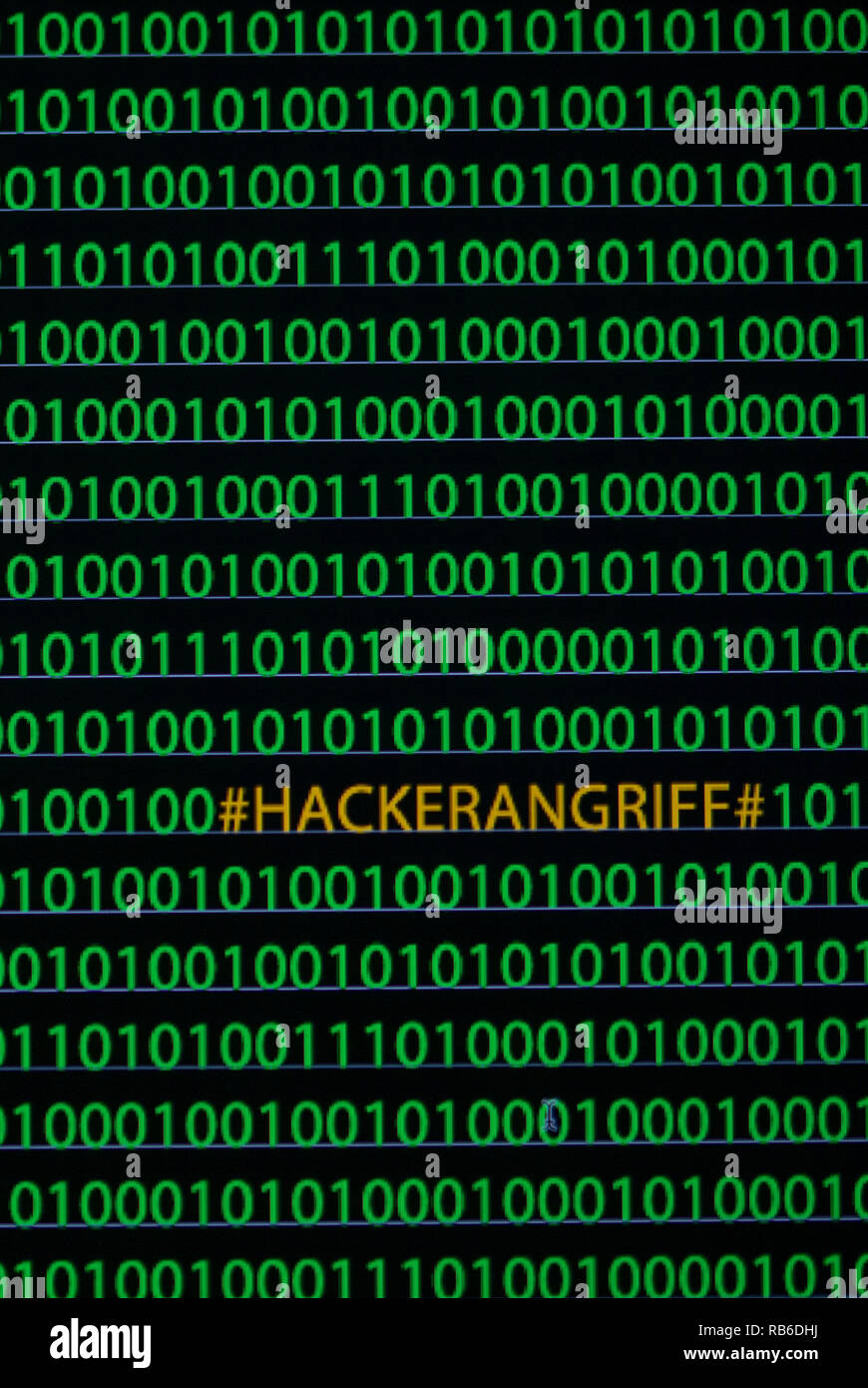 Schwerin, Germany. 04th Jan, 2019. Between the binary code on a laptop ...