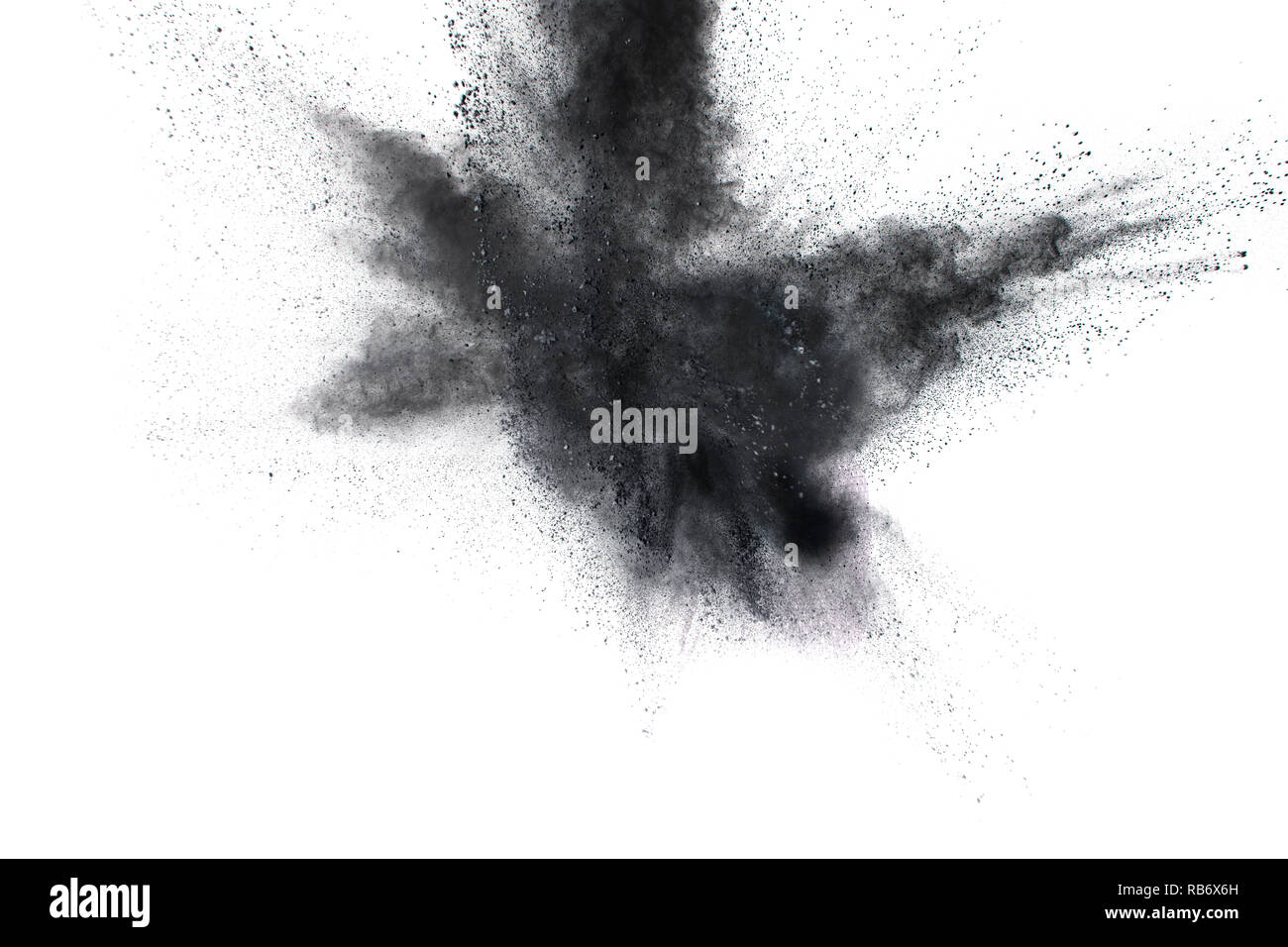 Black powder explosion against white background. Charcoal dust particle ...