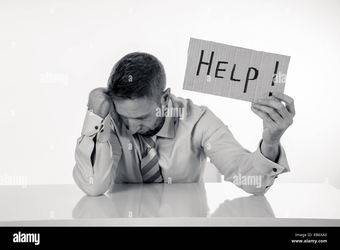 Young attractive frustrated and tired caucasian businessman holding ...