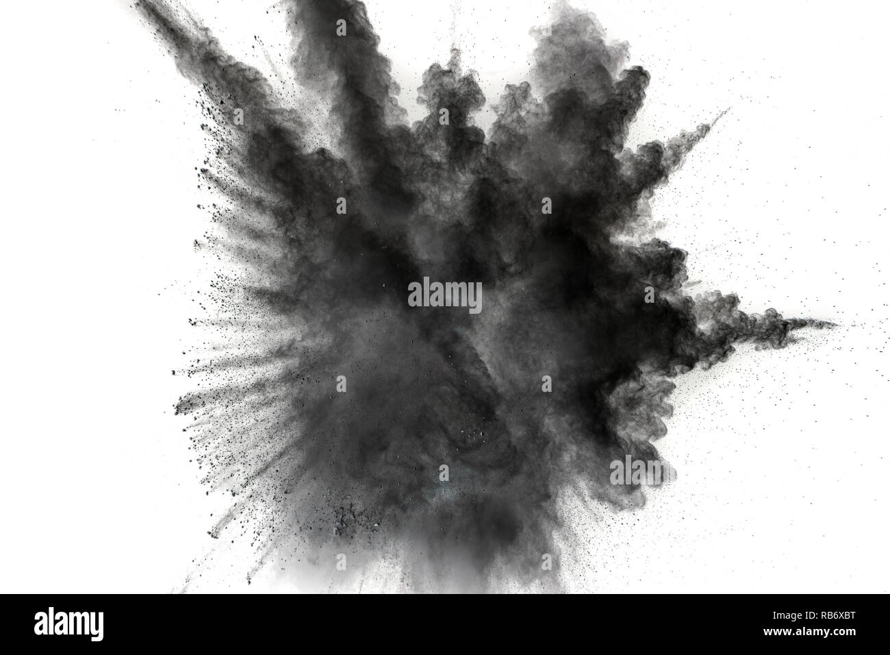 Black powder explosion against white background. Charcoal dust particle ...