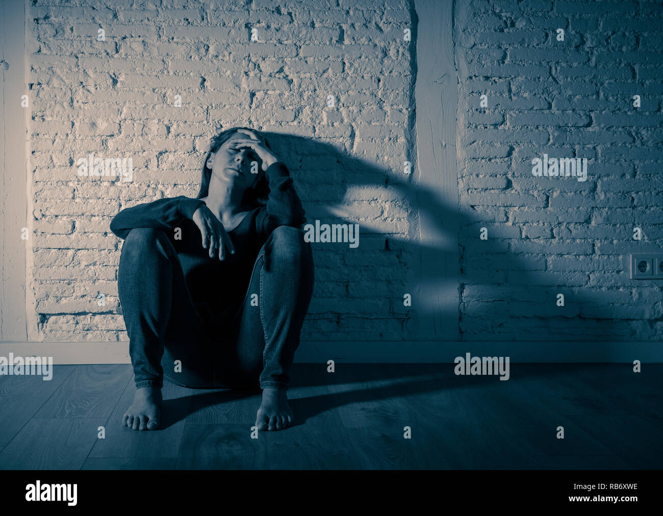 Young devastated depressed woman crying feeling hurt suffering ...