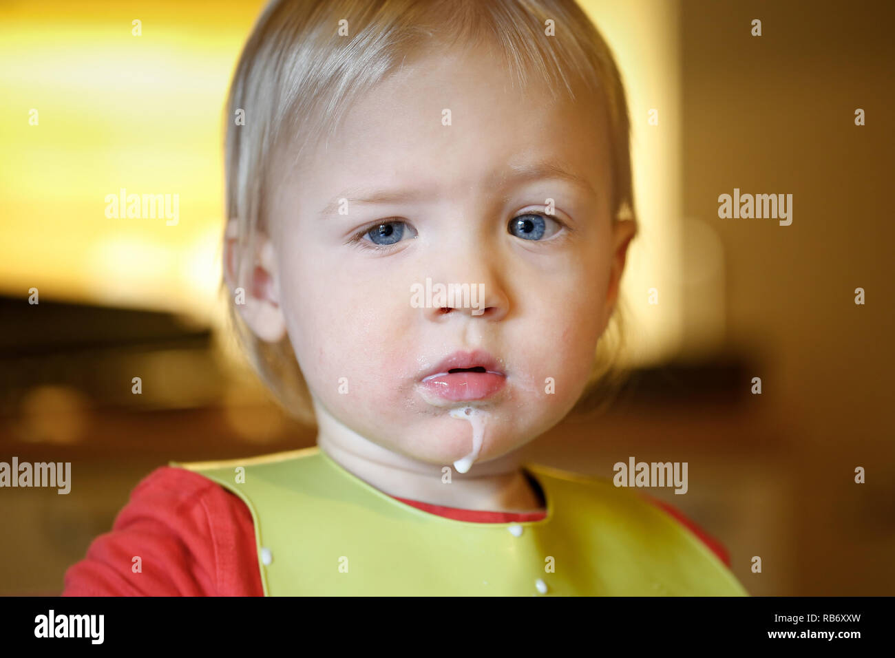 Toddler with milk moustache from eating independently, making a mess ...